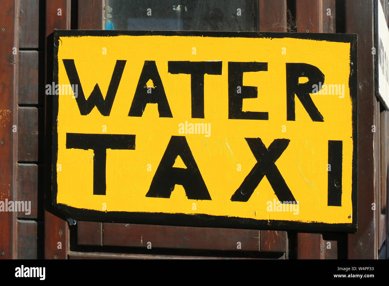 Water taxi sign written on wooden board in Venice Stock Photo - Alamy