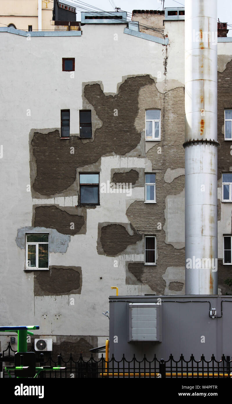 Old historic house in the city of St. Petersburg with a lot of patches ...