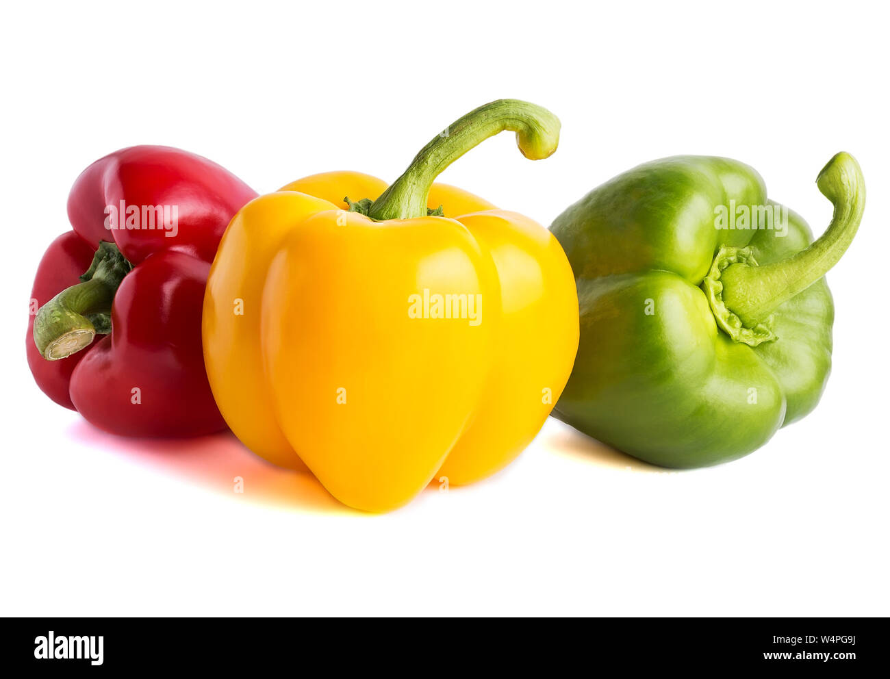 Three large peppers of different colors on a white background Stock ...