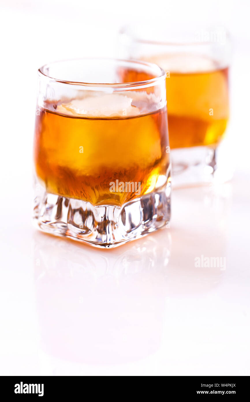 two rum shots on isolated background Stock Photo - Alamy