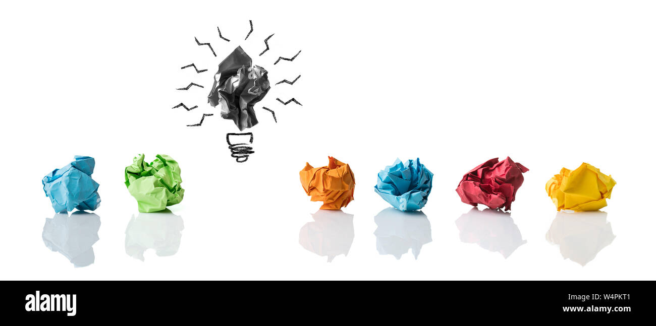 crumpled paper symbolizing different ideas with one highlighted as a ...