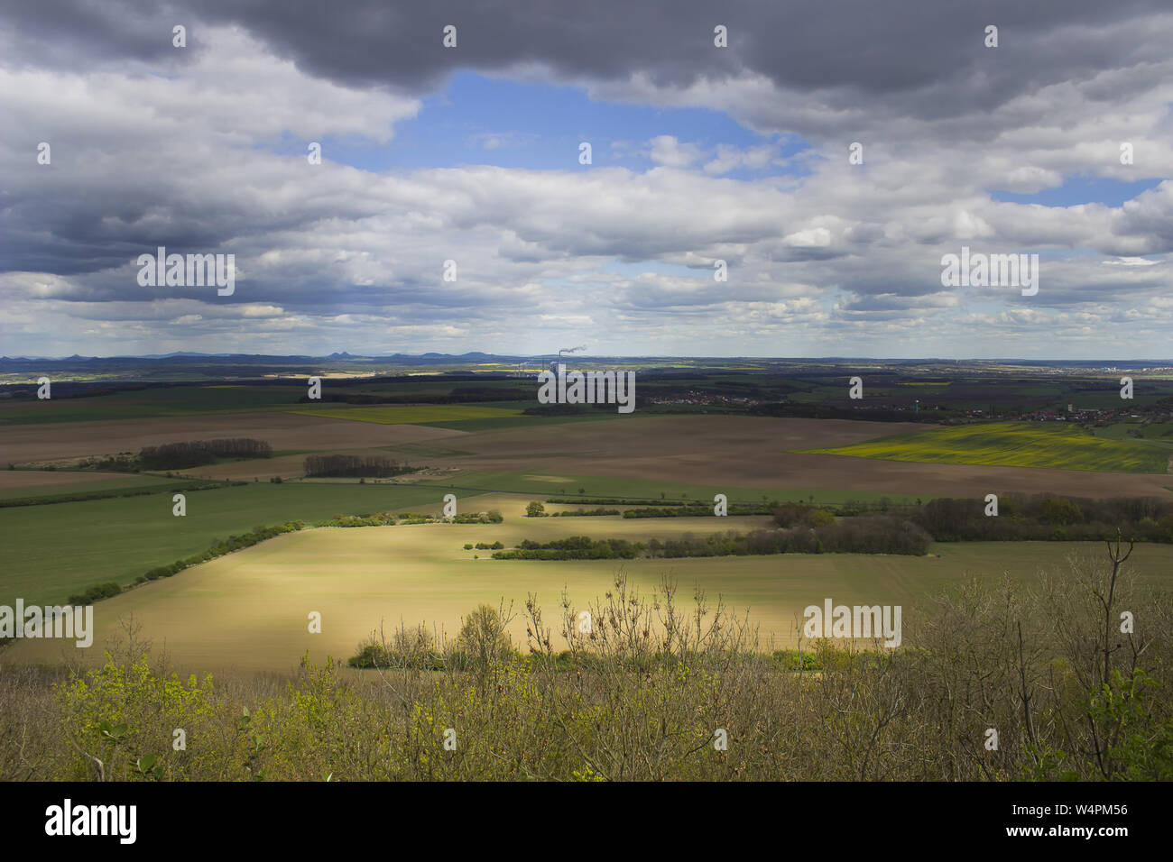 Large landscape with cloudy sky and selective sun shine Stock Photo - Alamy