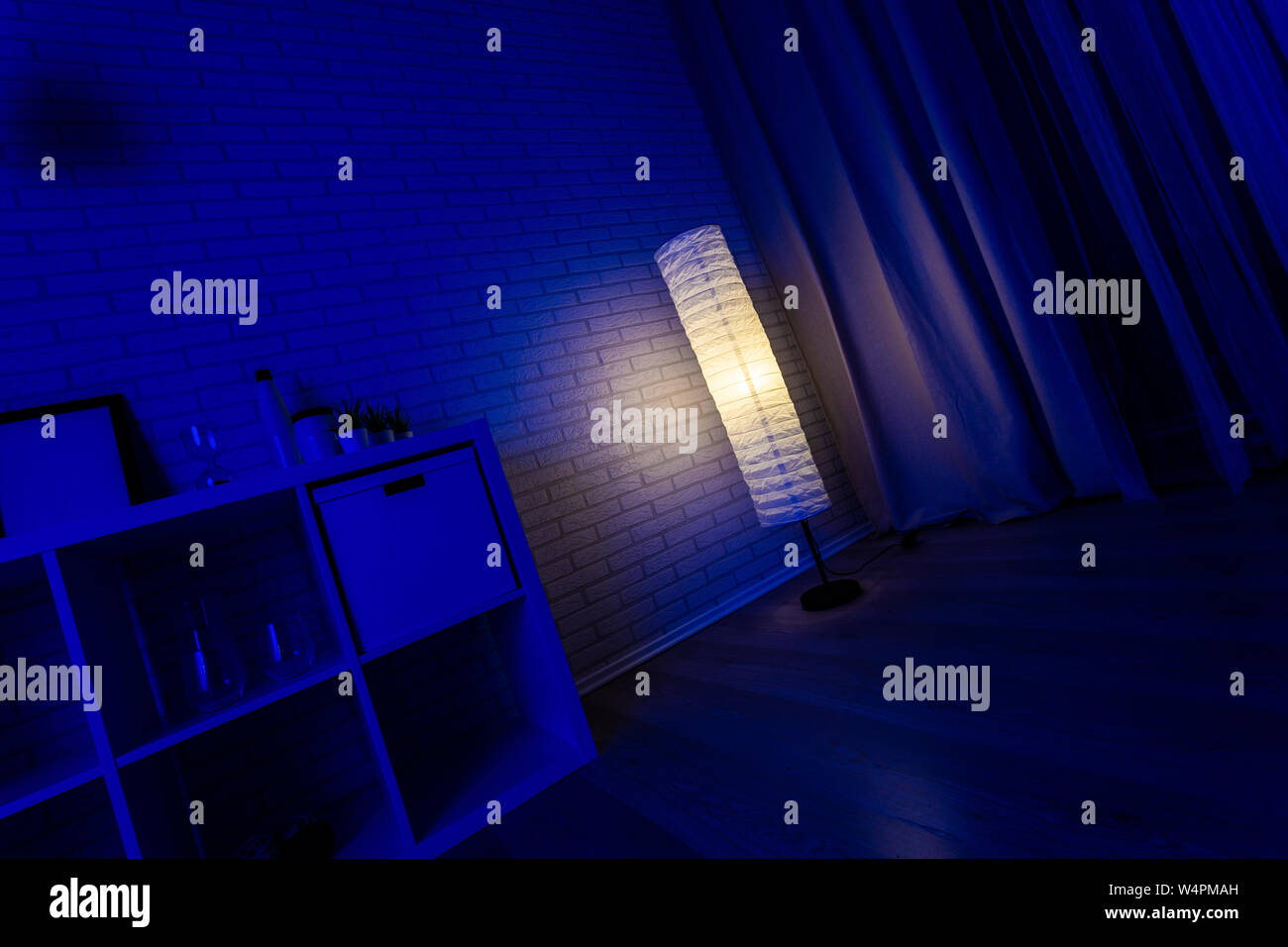Lamp in the night home interior Stock Photo - Alamy
