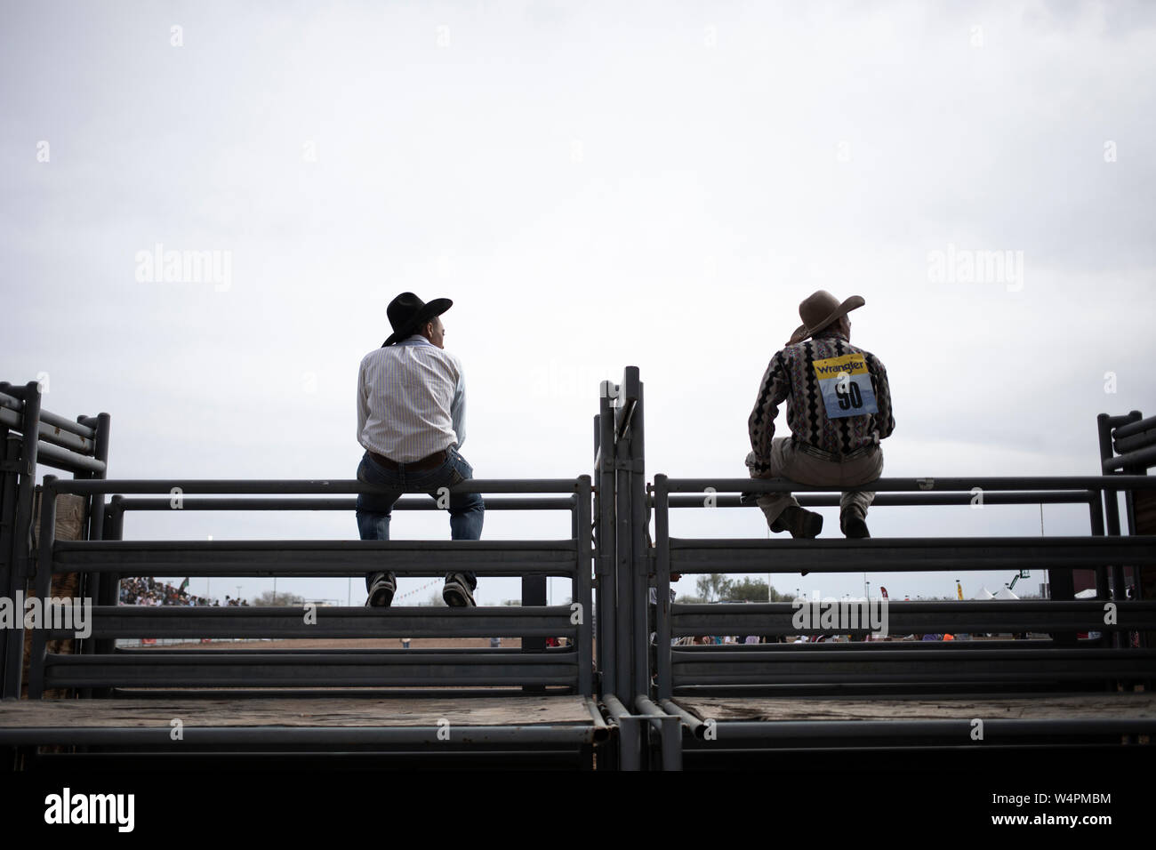 Cowboy sitting on fence hi-res stock photography and images - Alamy