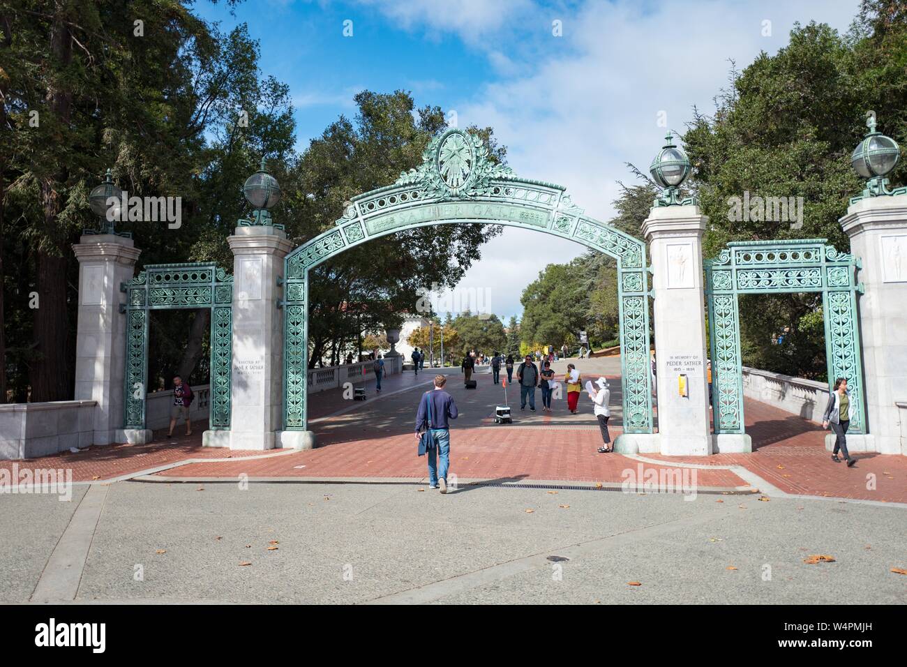 Student walk through Sather Gate, the iconic entrance gate to the ...