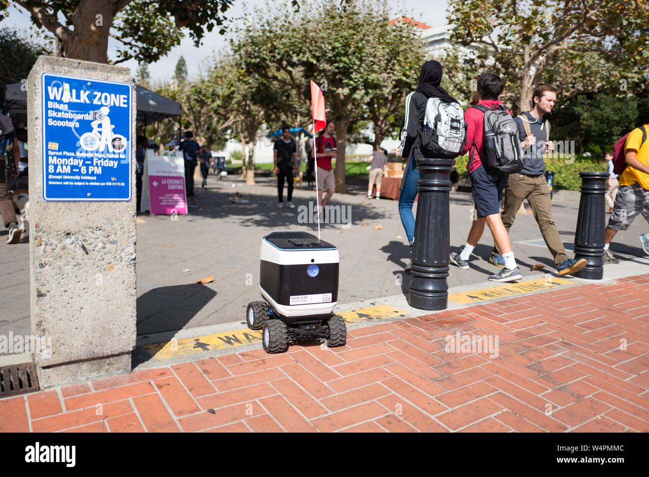 Autonomous food delivery robot drives hi-res stock photography and ...