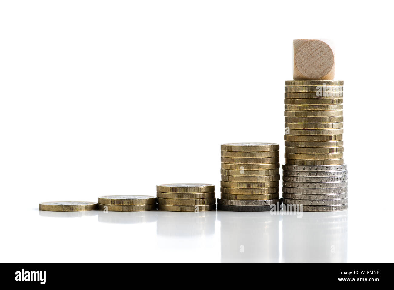 stacked coins showing a graph of overproportional growth Stock Photo ...
