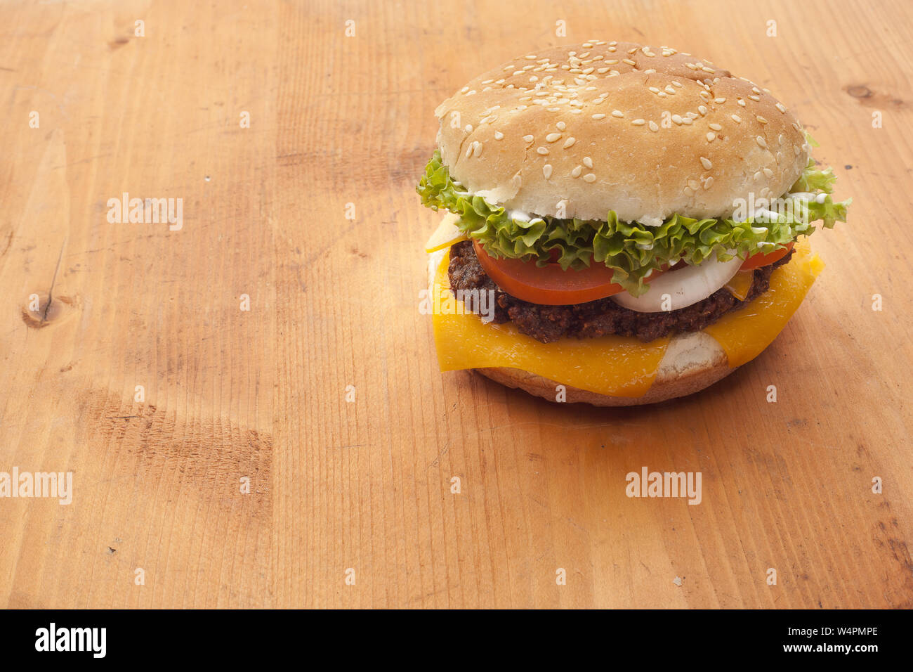 Delicious cheeseburger stacked high with a juicy beef patty, cheese ...