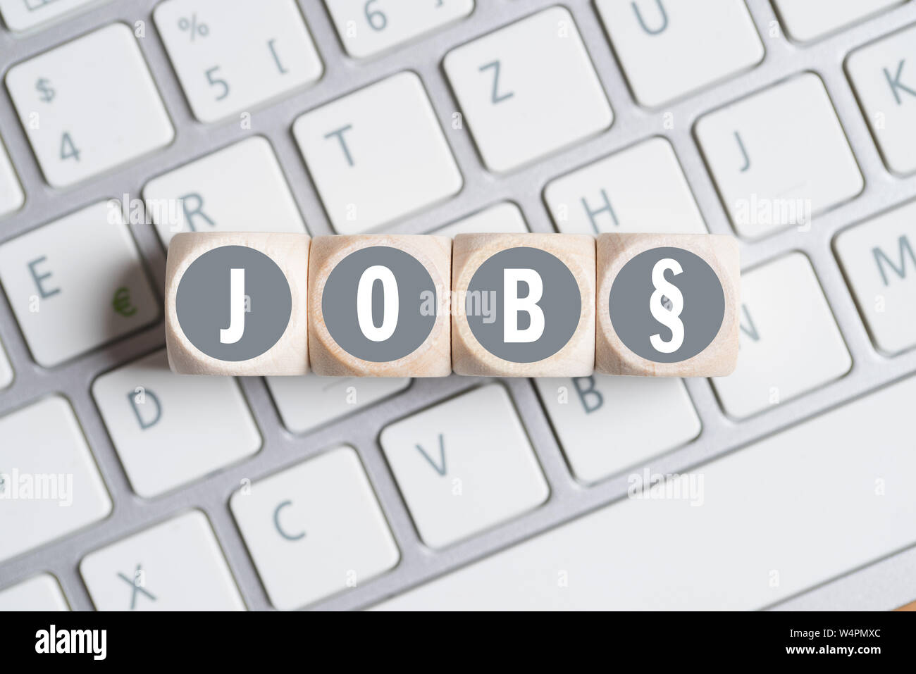 cubes with the word "JOB" and a paragraph symbol on a keyboard Stock ...