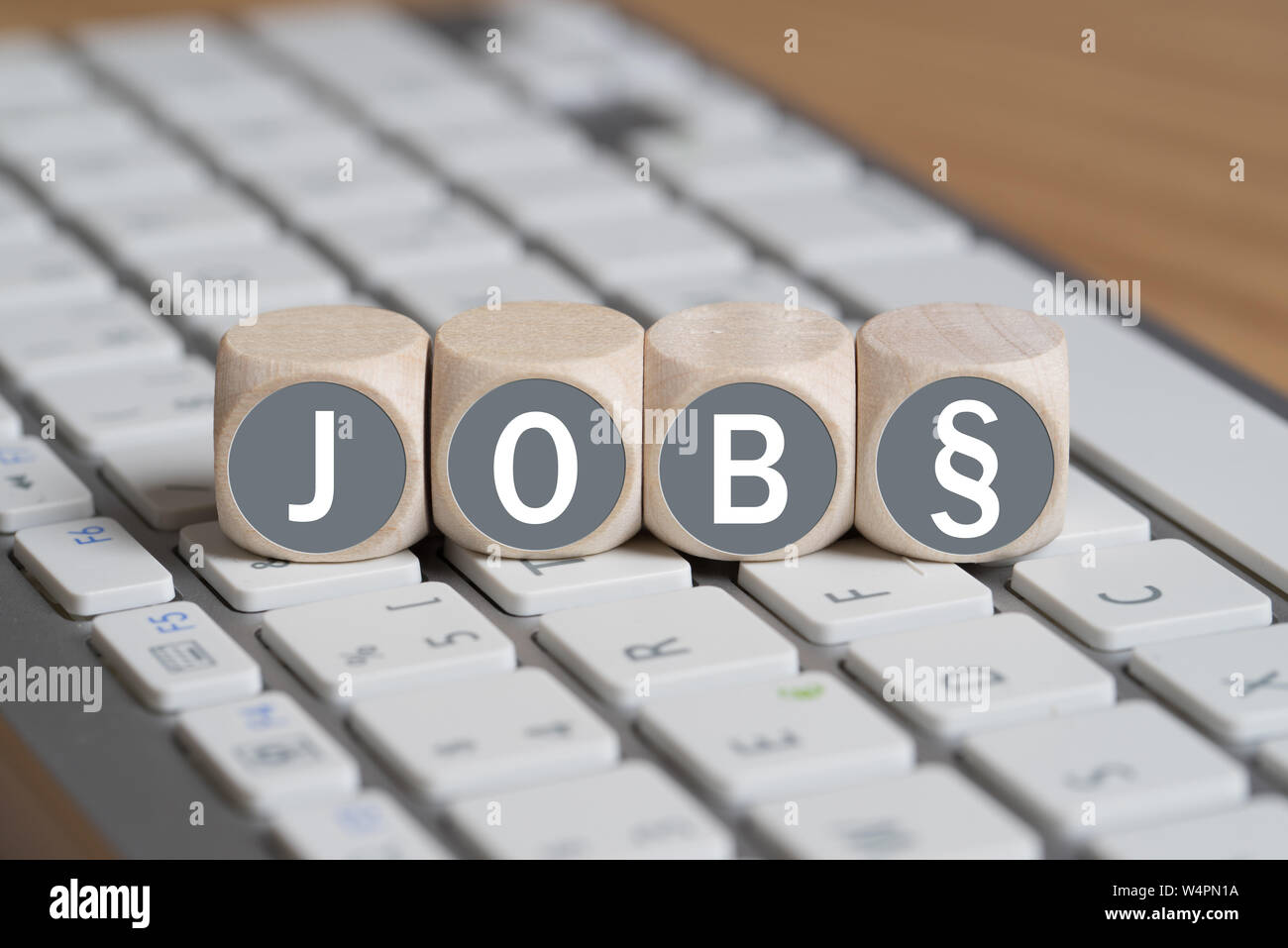 cubes with the word "JOB" and a paragraph symbol on a keyboard Stock ...