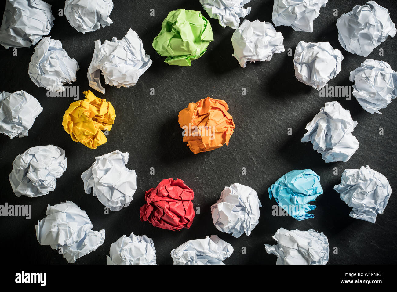 crumpled paper symbolizing different solutions with some standing out ...