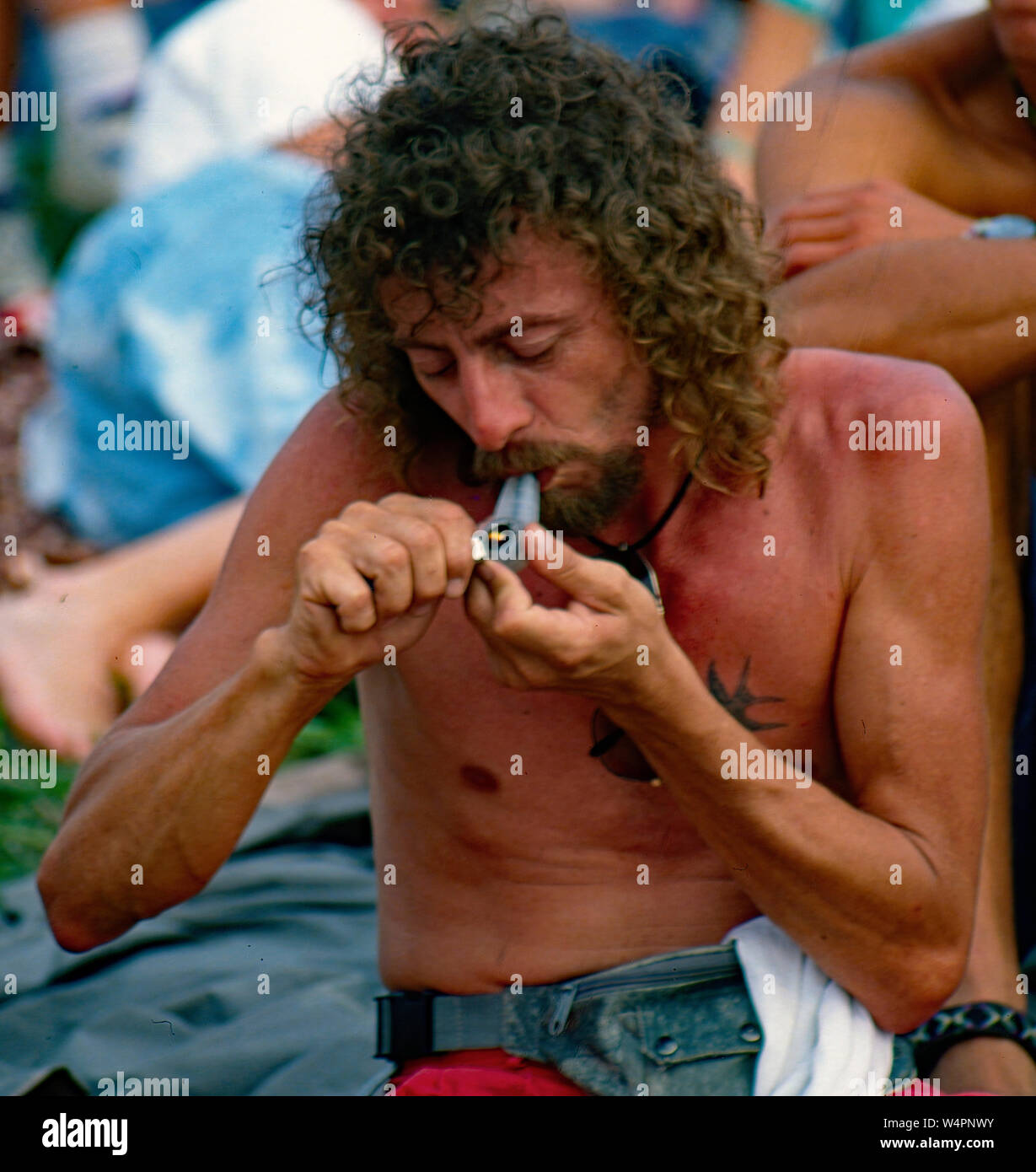 Saugerties, New York, USA, August, 1994Man lights up a pipe of ...