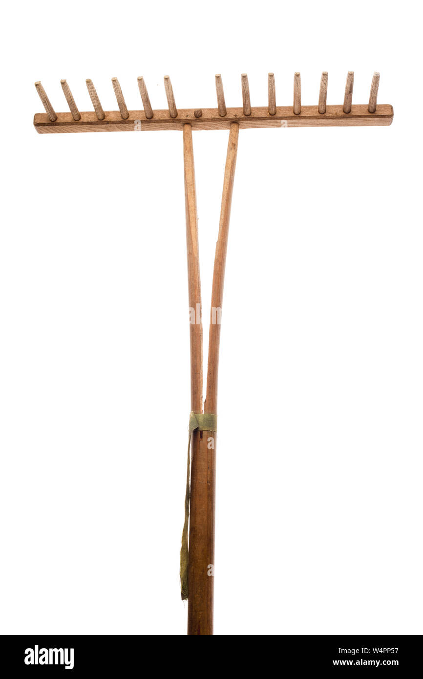 Old garden rake on white background Stock Photo - Alamy