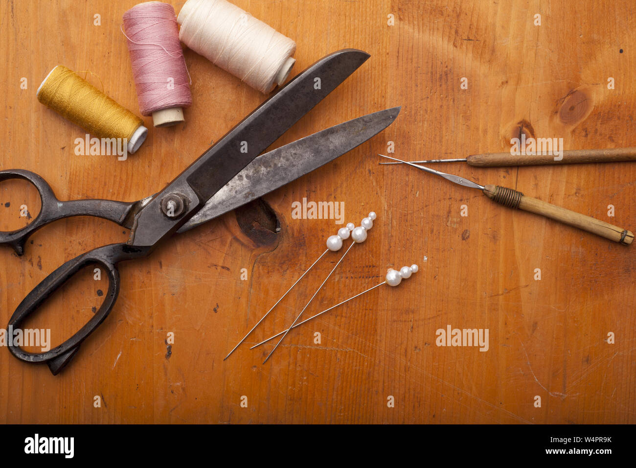 dressmaker shears with spool of threads, Crochet tool craft concept on ...