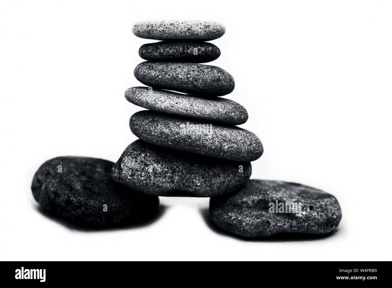A bunch of pebbles or small stones on each other isolated on white ...