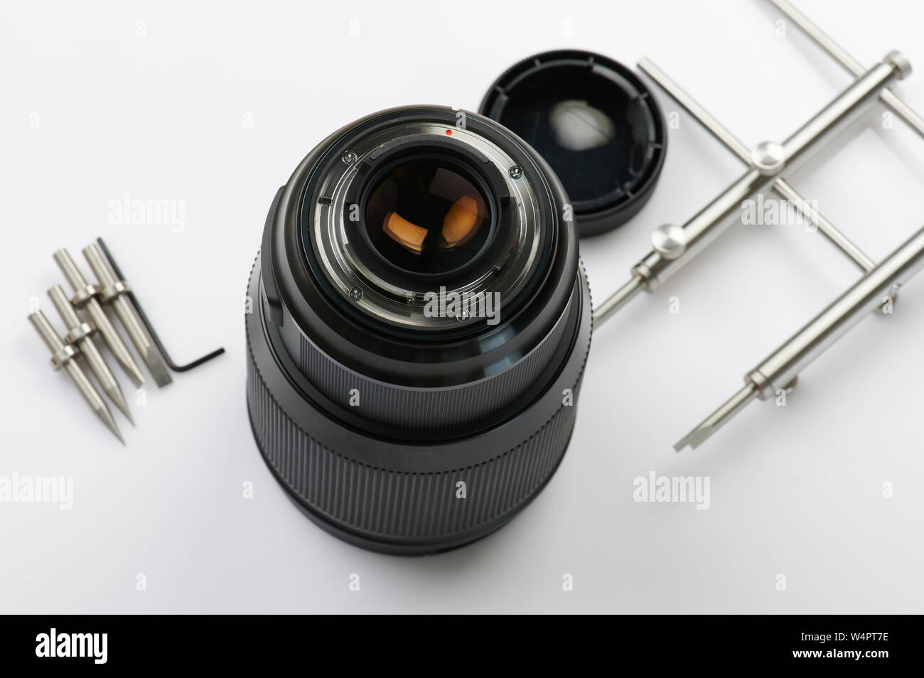 Clean lens after service with tools on white background Stock Photo - Alamy