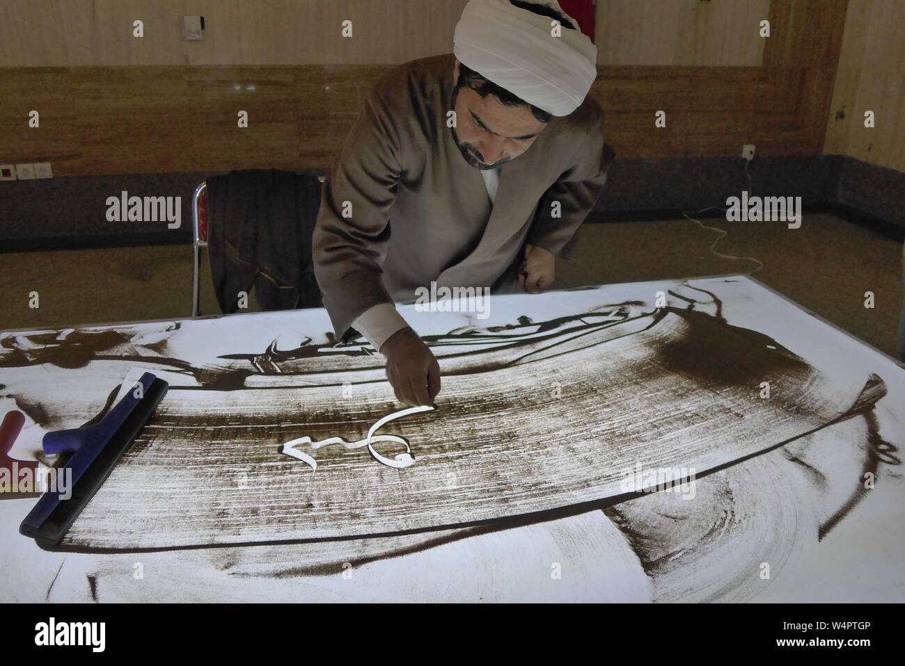Man writes persian characters hi-res stock photography and images - Alamy