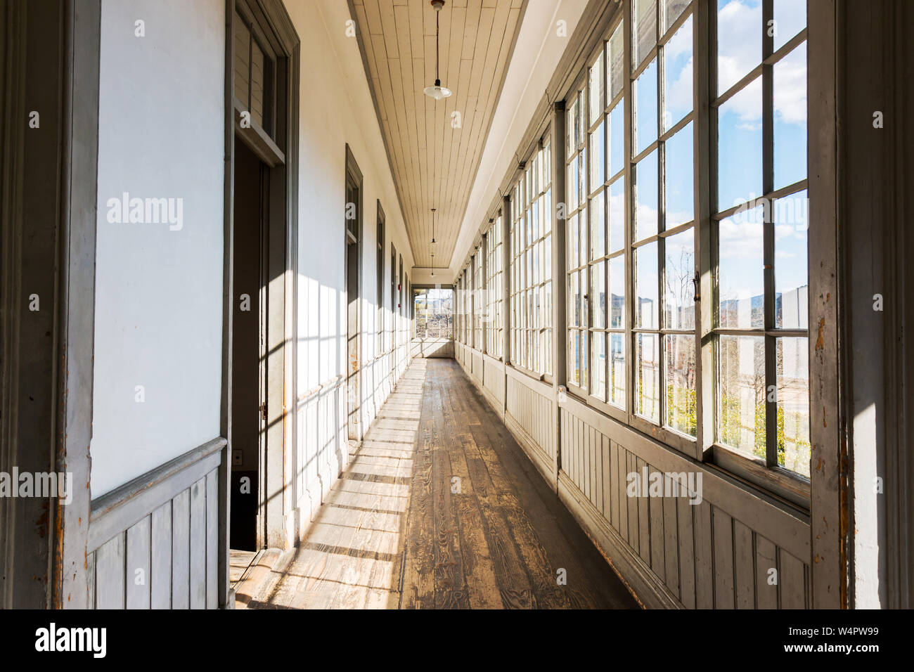 balcony walkway in old abandoned building with sunlight Stock Photo - Alamy