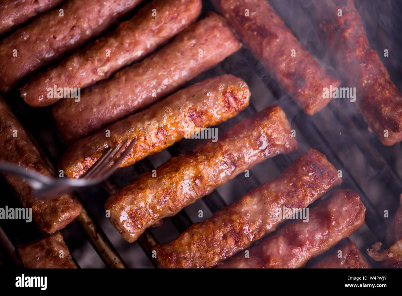 Assorted delicious grilled meat over the coals on barbecue Stock Photo ...