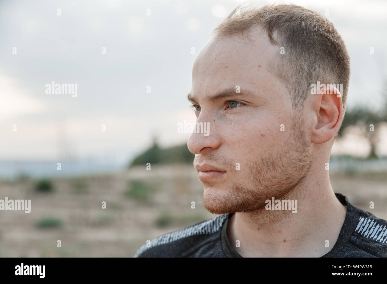 portrait of a sporty young Caucasian guy in a black t-shirt Stock Photo ...