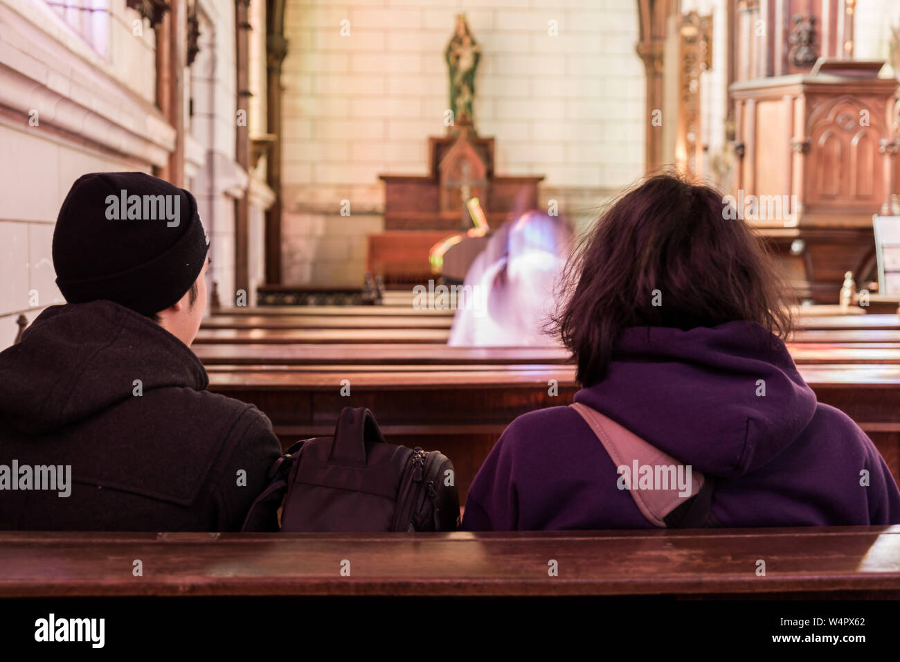 men in church interior sitting back on praying Stock Photo - Alamy