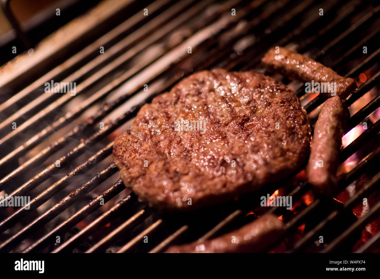 Assorted delicious grilled meat over the coals on barbecue Stock Photo ...