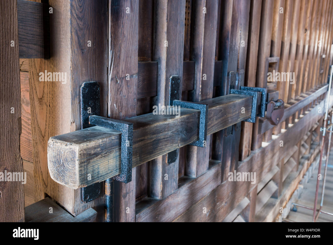 Old prison locked wooden key, wooden gate lock Stock Photo - Alamy