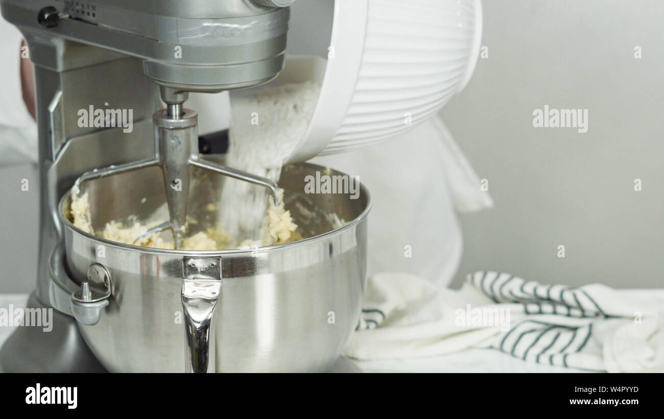 Step by step. Mixing ingredients in standing kitchen mixer to bake ...