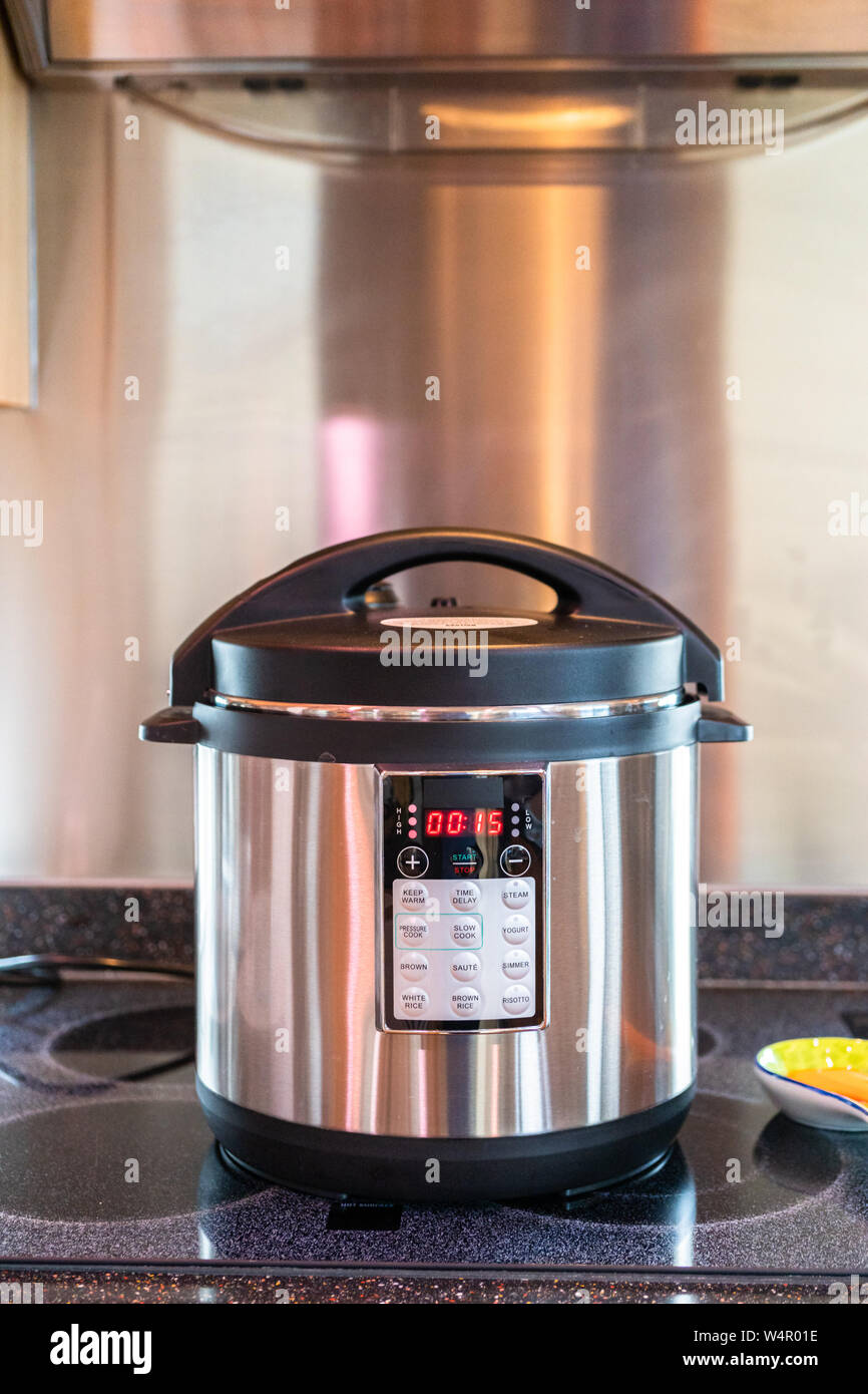 Cooking dinner in a pressure cooker in a modern kitchen Stock Photo - Alamy