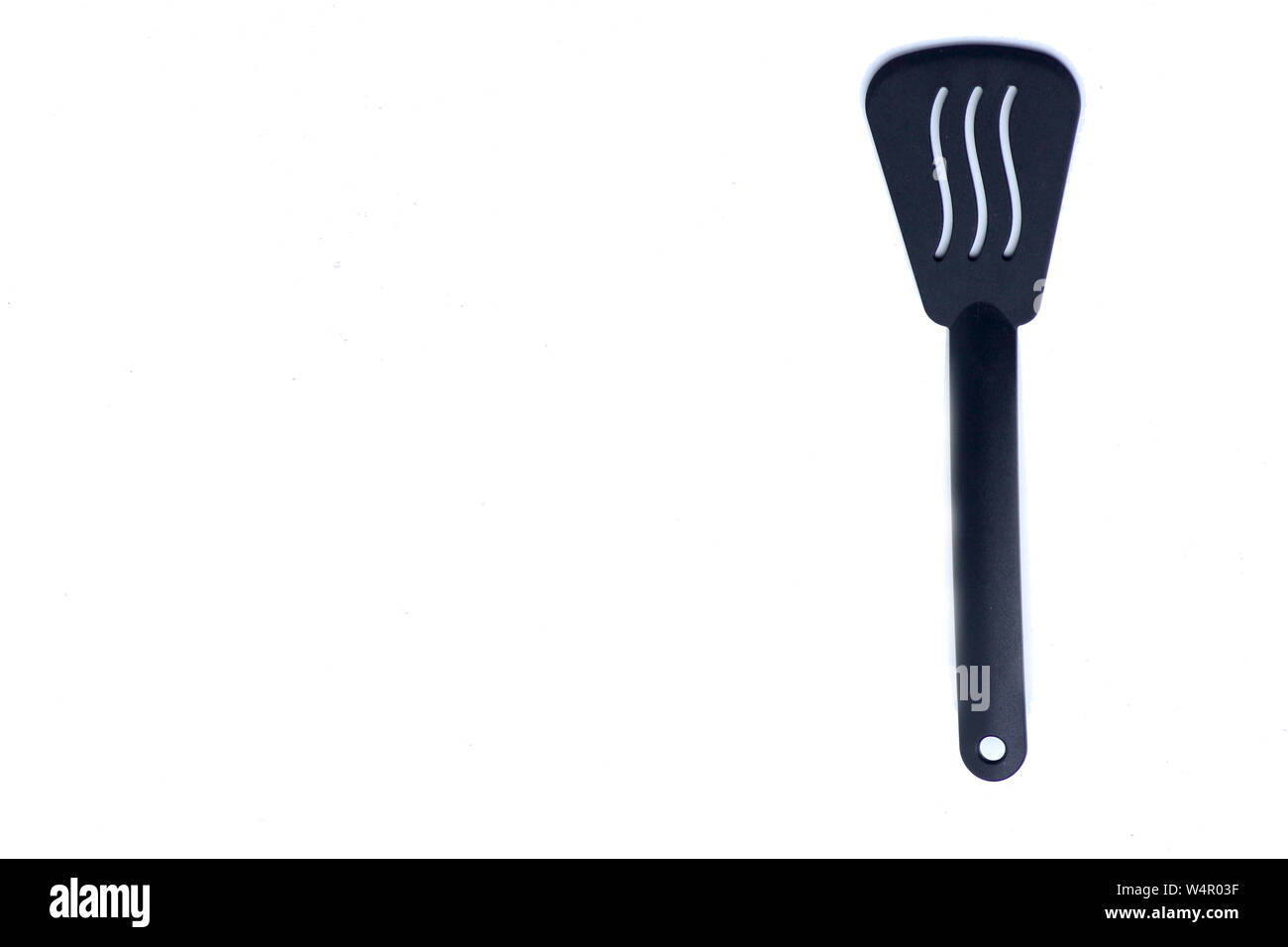 black plastic turner isolated on white background. Image contains copy ...
