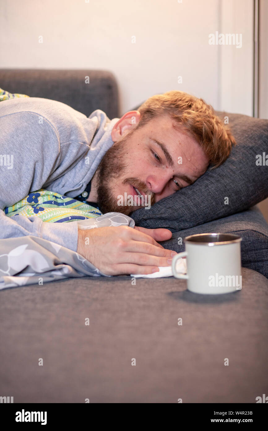 Man laying in bed sick hi-res stock photography and images - Alamy