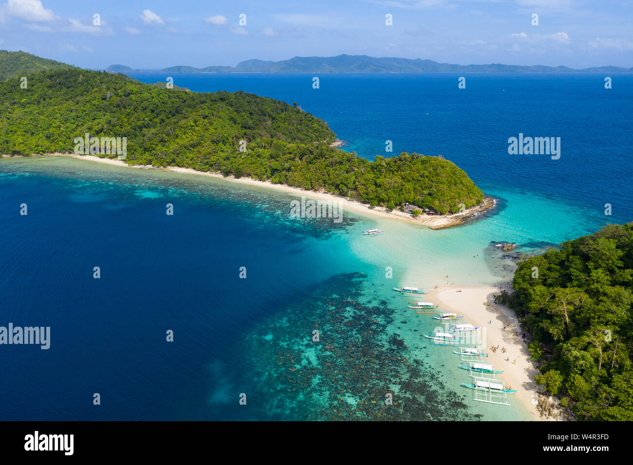Aerial image of outrigger boats moored on the beach at Paradise Island ...