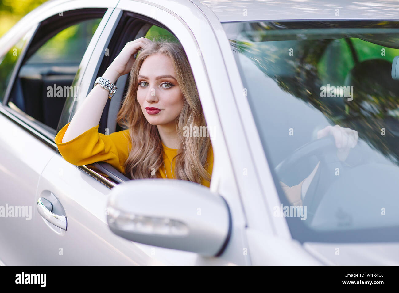 A young beutiful girl is driving a car Stock Photo - Alamy