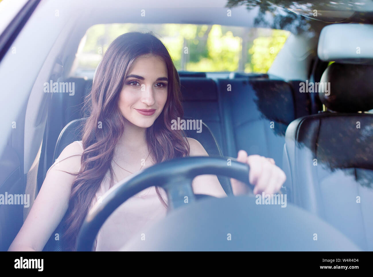 A young beutiful girl is driving a car Stock Photo - Alamy