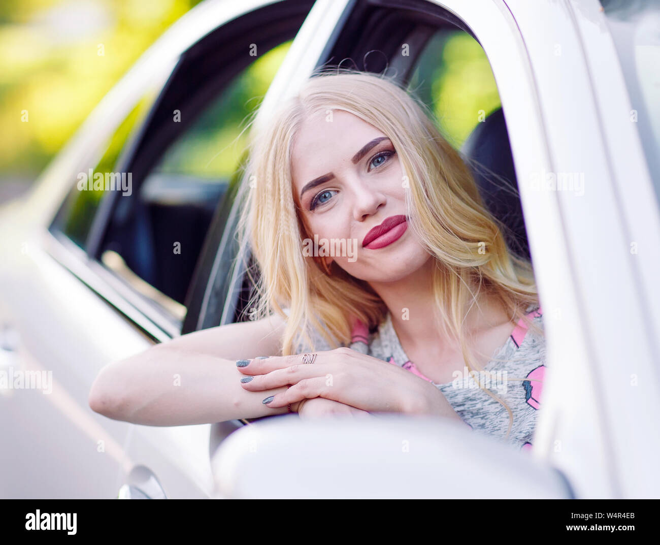 A young beutiful girl is driving a car Stock Photo - Alamy