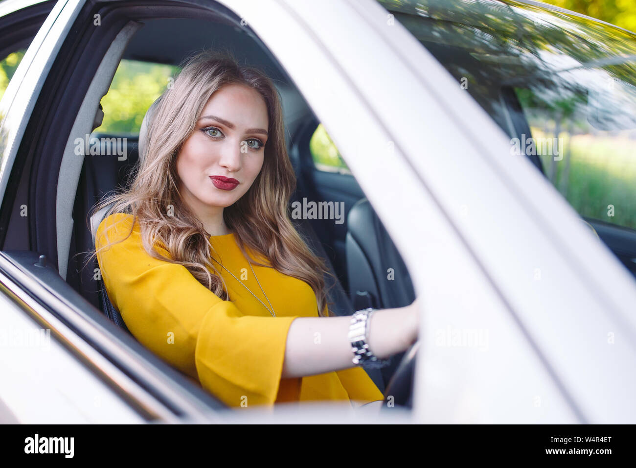 A young beutiful girl is driving a car Stock Photo - Alamy