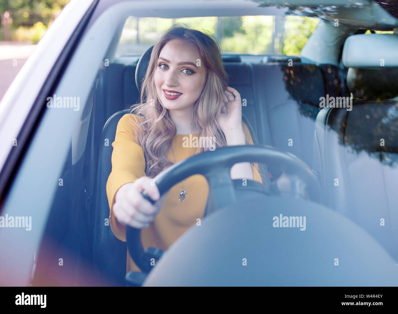 A young beutiful girl is driving a car Stock Photo - Alamy