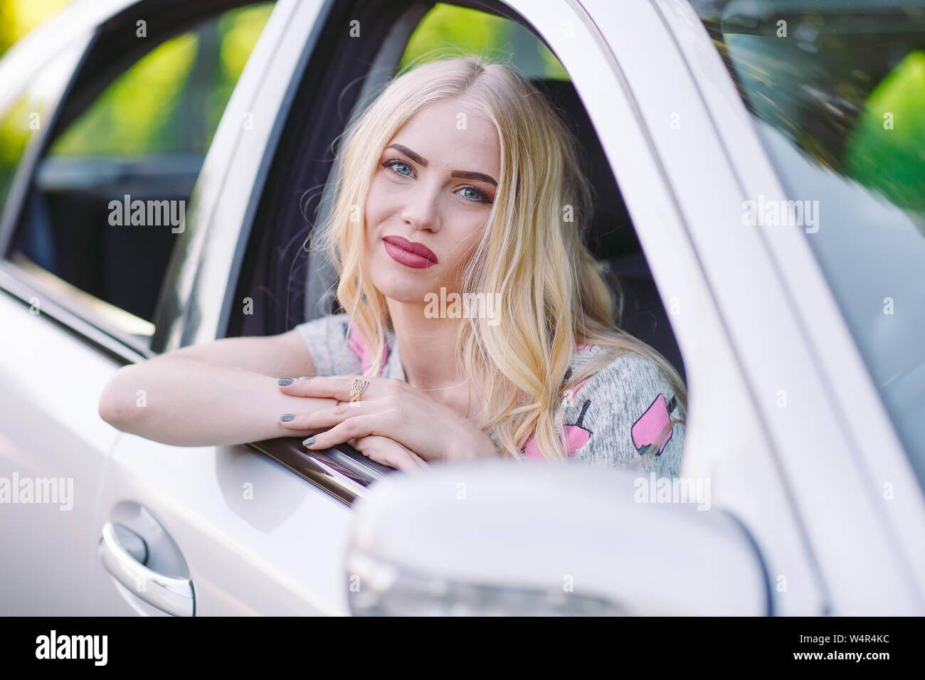 A young beutiful girl is driving a car Stock Photo - Alamy