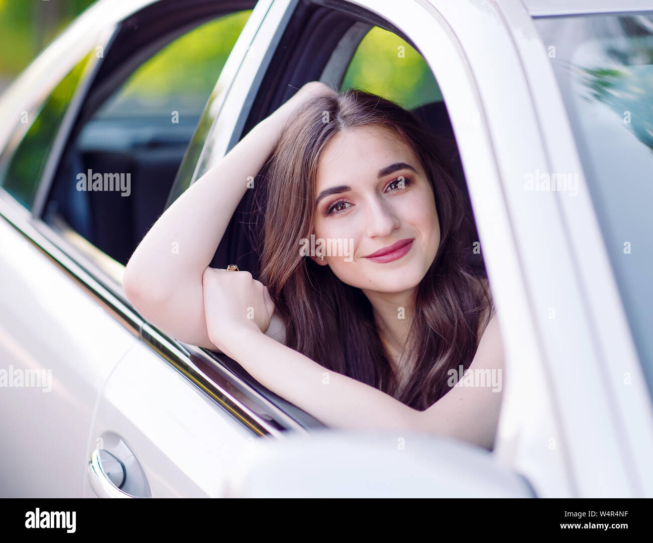 A young beutiful girl is driving a car Stock Photo - Alamy