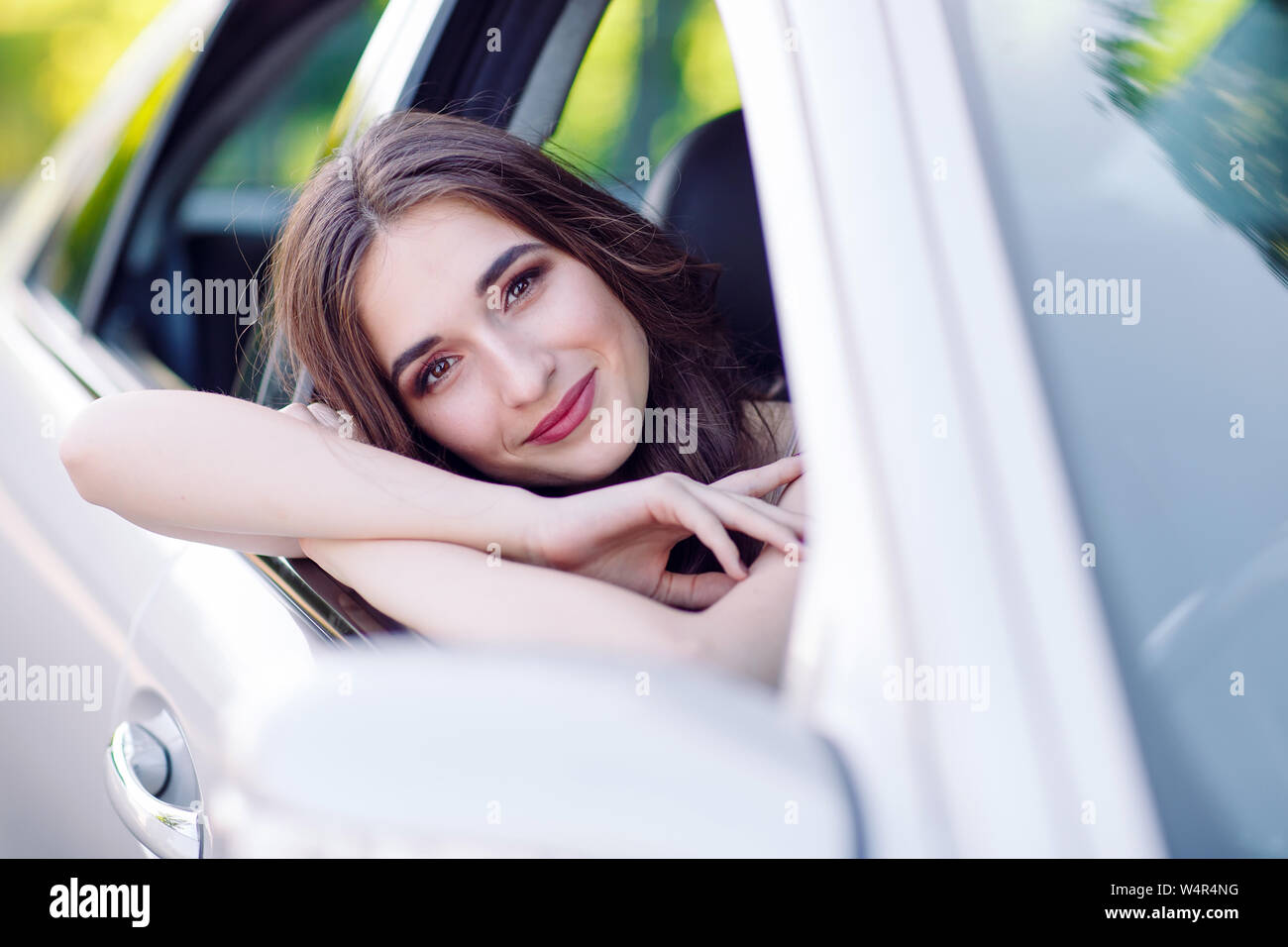 A young beutiful girl is driving a car Stock Photo - Alamy
