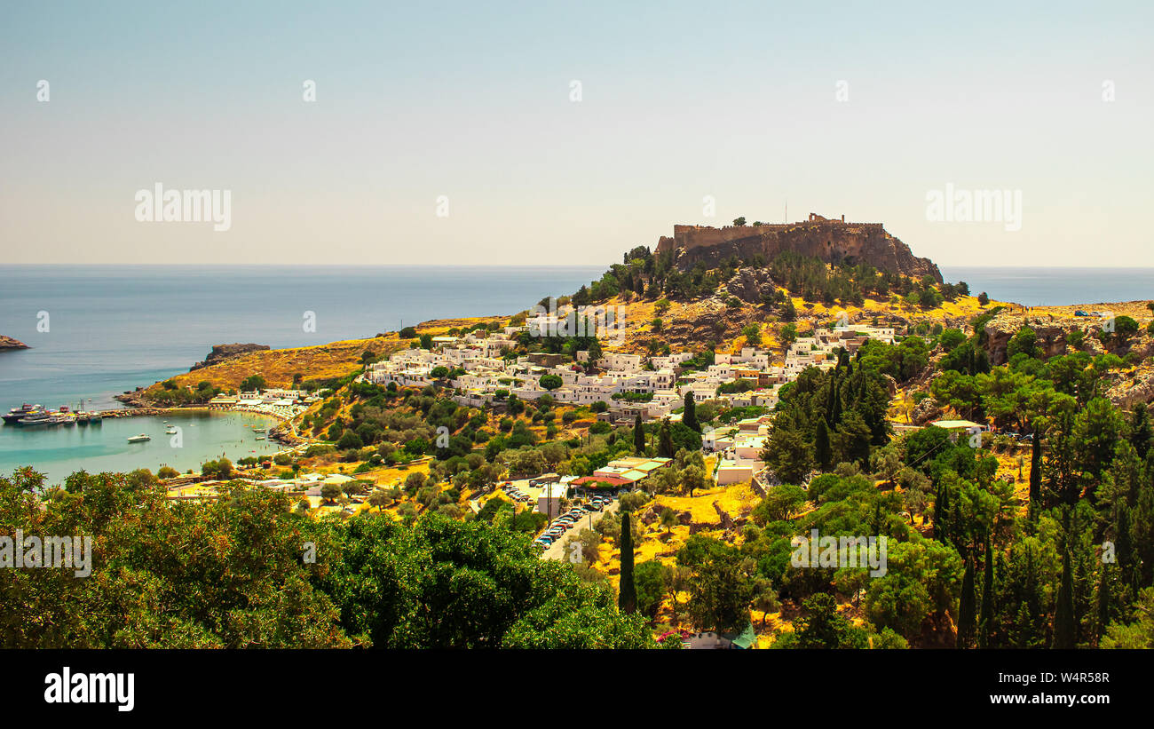 The historic city of Lindos and the Acropolis of Lindos in beautiful ...