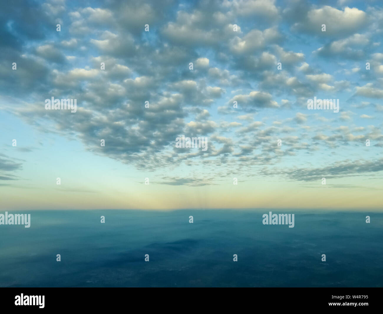 Aerial view from aircraft window with clouds Stock Photo - Alamy