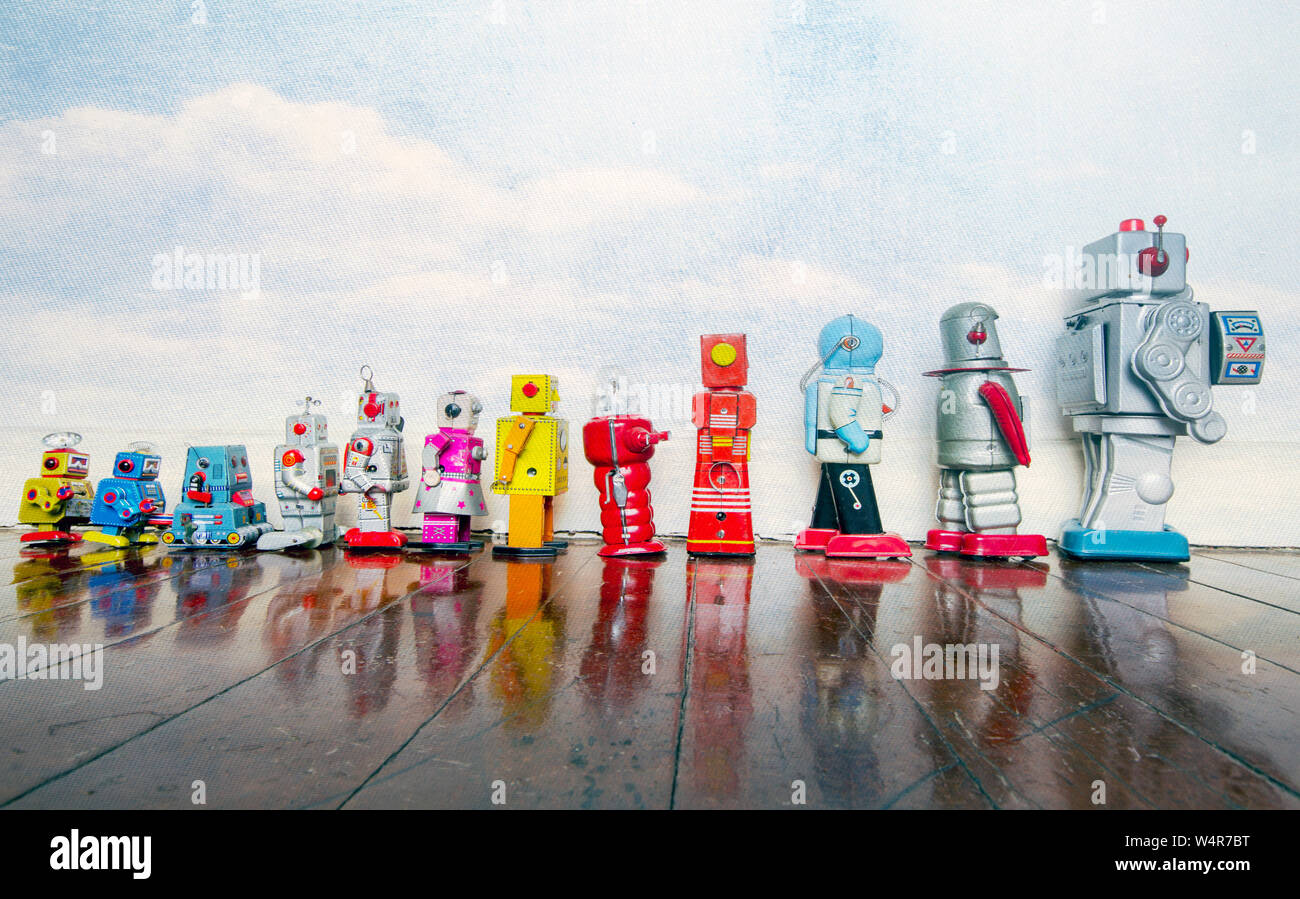 a line of vintage robots from small to big Stock Photo - Alamy