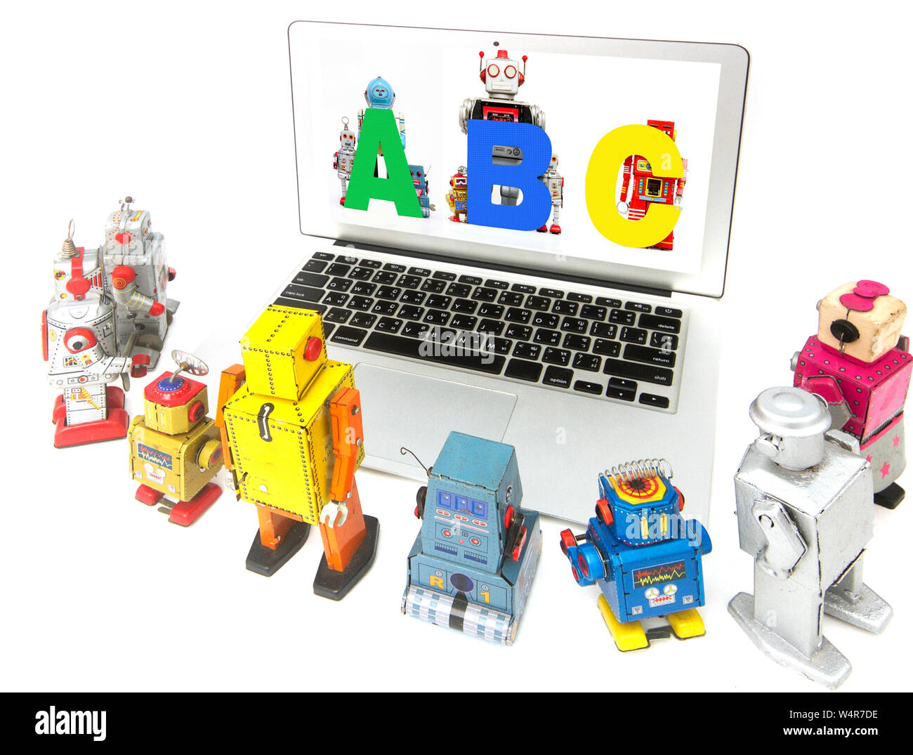 robot toys learing ABC on a laptop computer isolated image Stock Photo ...