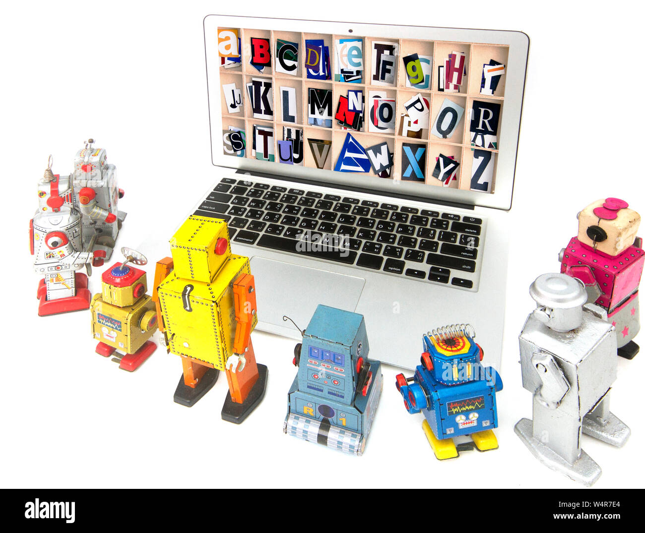 robot toys learing ABC on a laptop computer isolated image Stock Photo ...