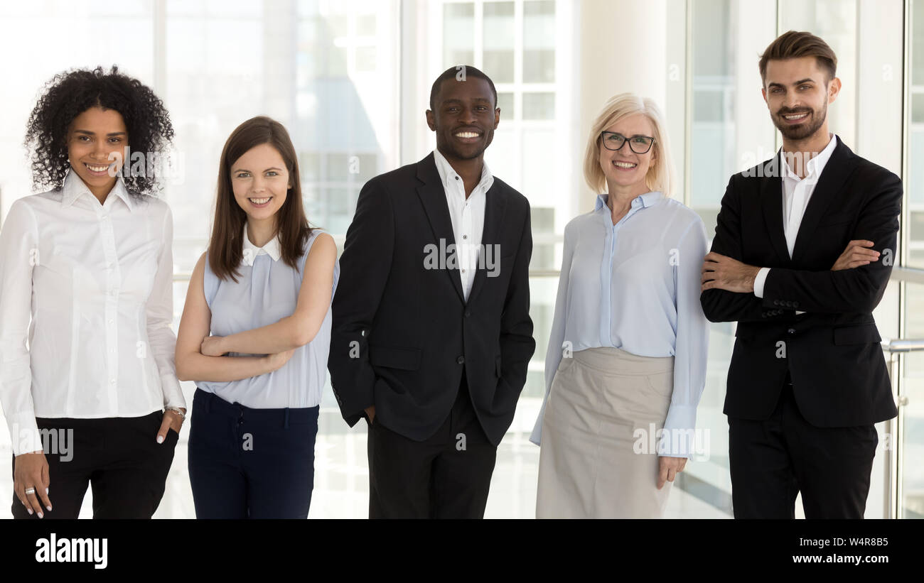 Business team look in camera stand hi-res stock photography and images ...