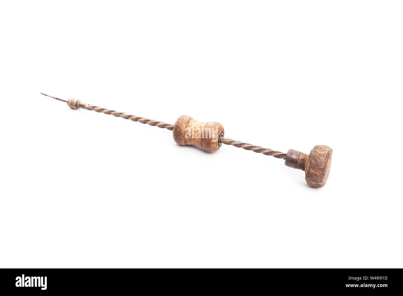 Antique drill bit isolated on white background Stock Photo - Alamy
