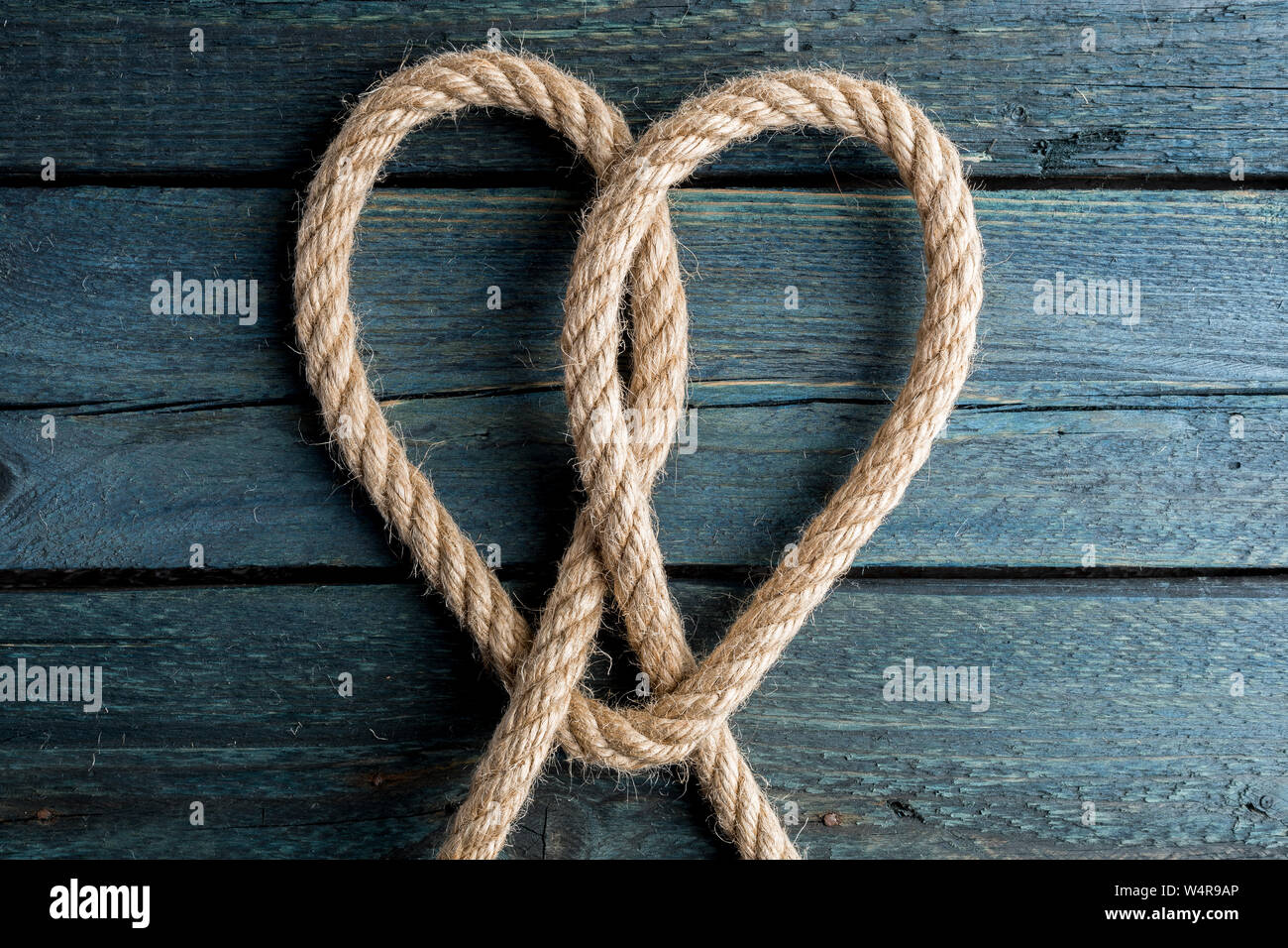 Love rope. Heart rope knot Stock Photo - Alamy
