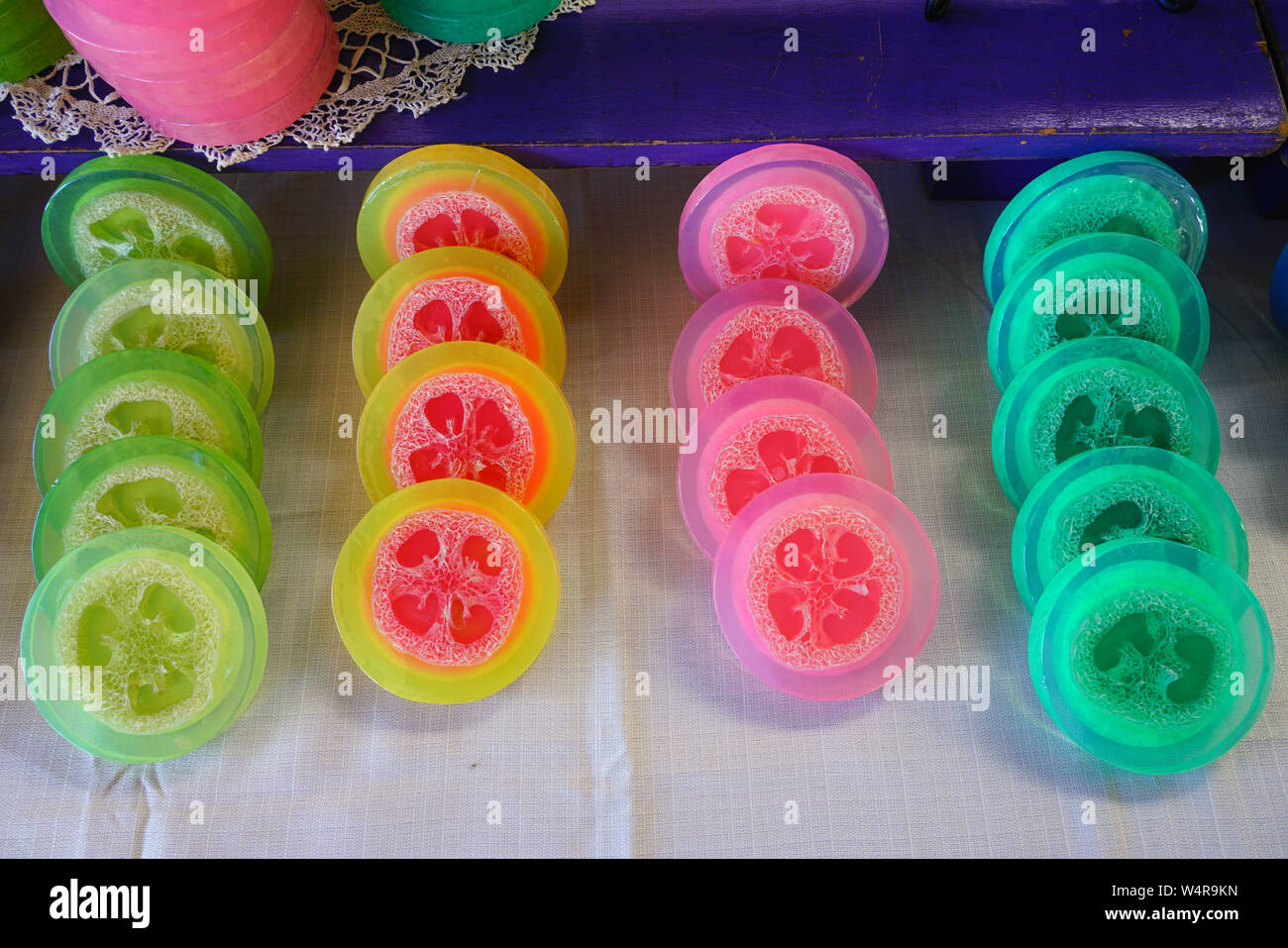 Colorful round soaps made with loofah sponge Stock Photo - Alamy