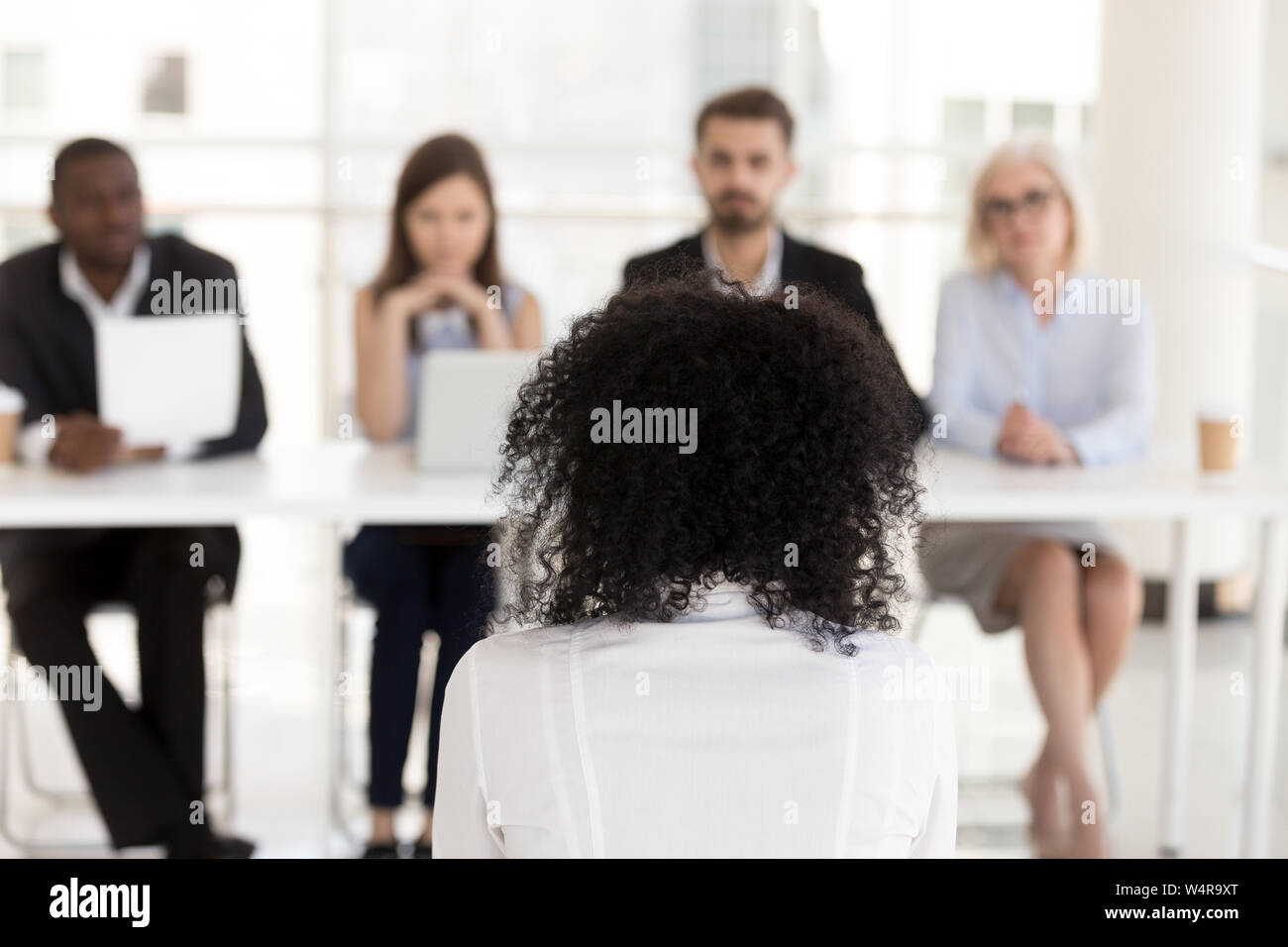 African American female applicant at job interview rear view Stock ...